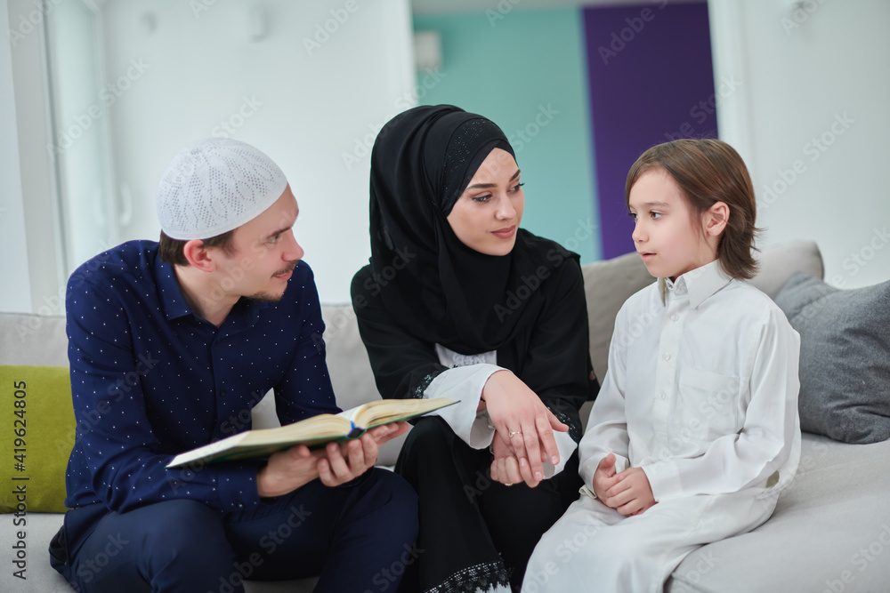 Young muslim family reading Quran during Ramadan Stock Photo | Adobe Stock