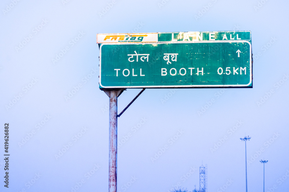 Toll booth sign near a toll booth showing the new cashless RFID based ...