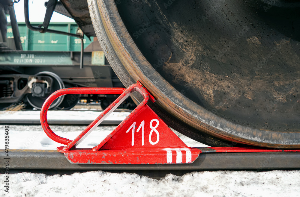 Brake shoe of rail wheel of train on the rail. Winter shoot. Close-up ...