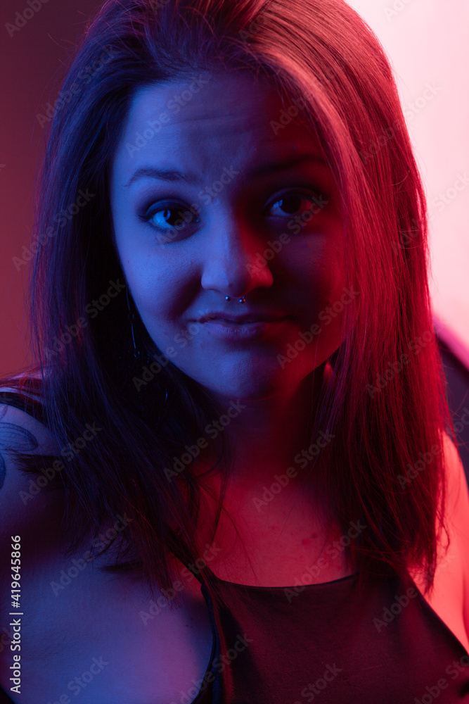 Weird lady, woman or girl, making a silly face. Blue and pink or ...