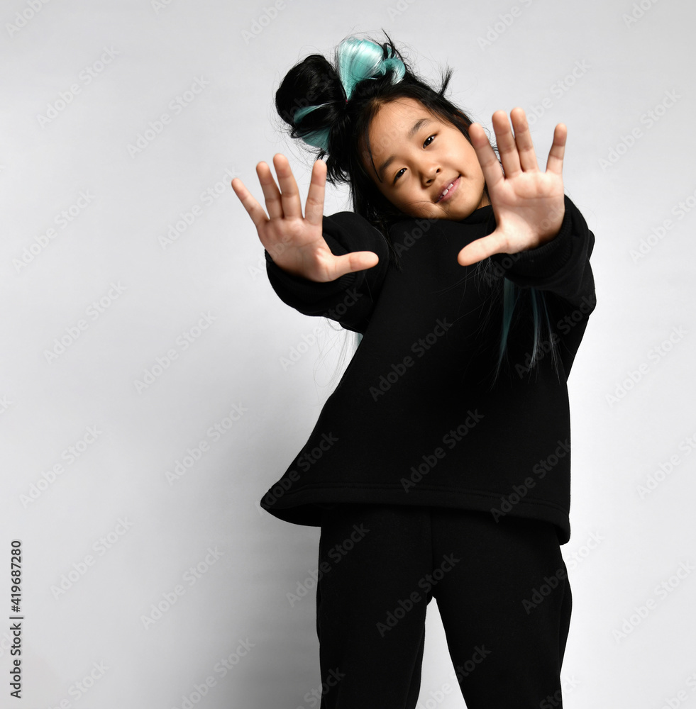 portrait of cute asian teenage girl with two arms outstretched forward ...