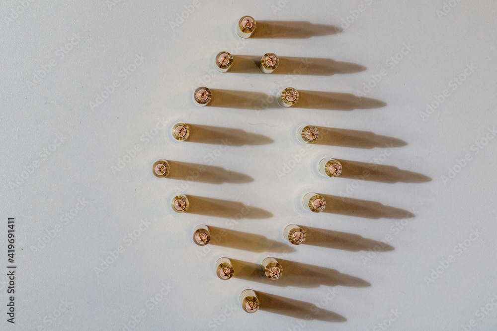 5.56mm bullets arranged in the shape of a diamond lit from the left ...