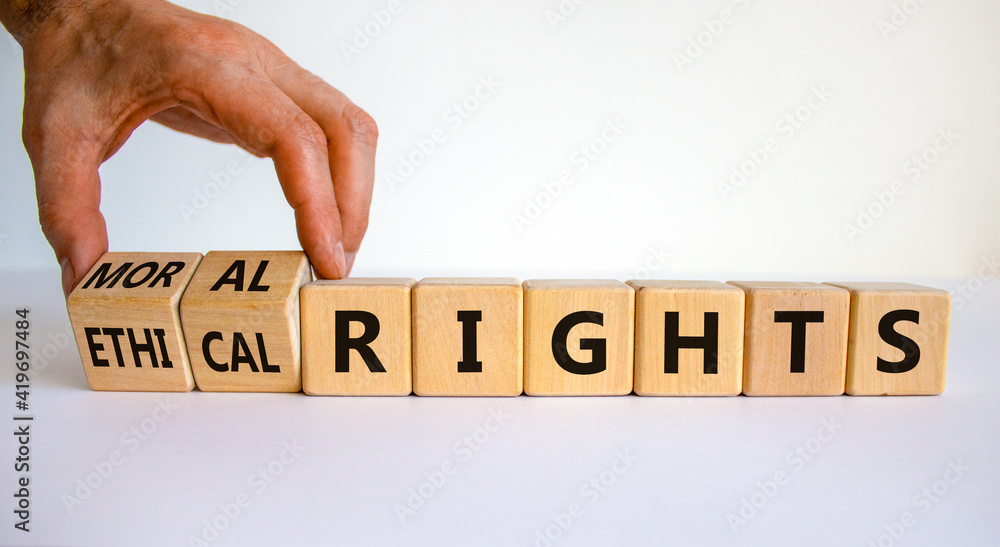 Ethical or moral rights symbol. Businessman turns wooden cubes and ...