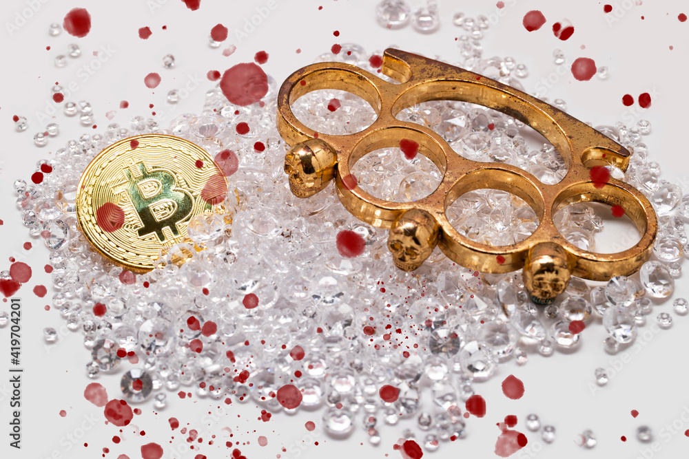 Zdjęcie Stock: Drops of blood on Bitcoin and brass knuckles with ...