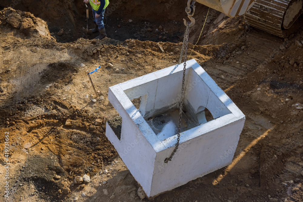 Water drainage at road construction site the square concrete manholes ...