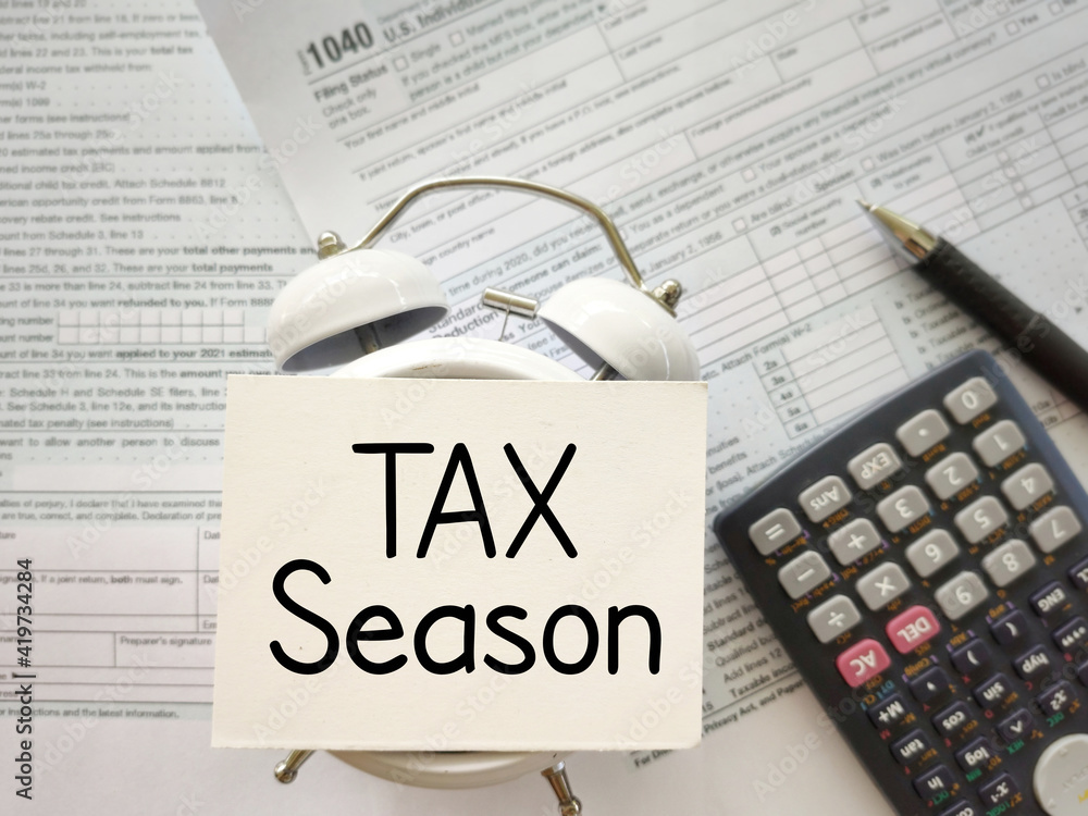 Tax-filling concept - Tax season text on white surface. Top view ...