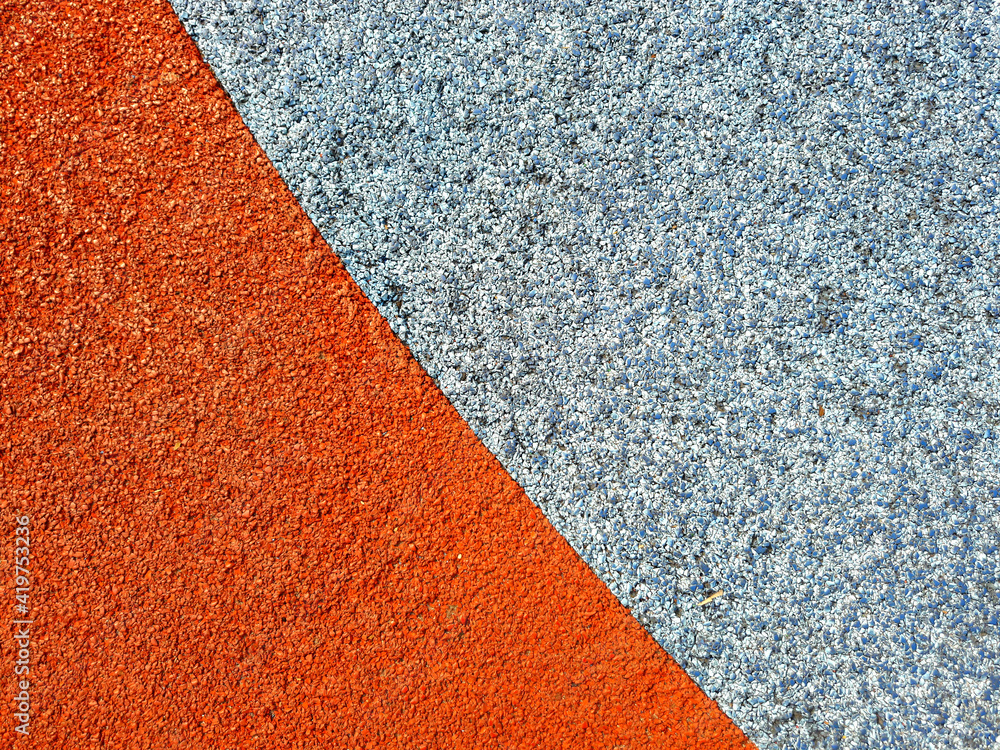 Rubber floor texture background. EPDM playground surface. Blue and red ...