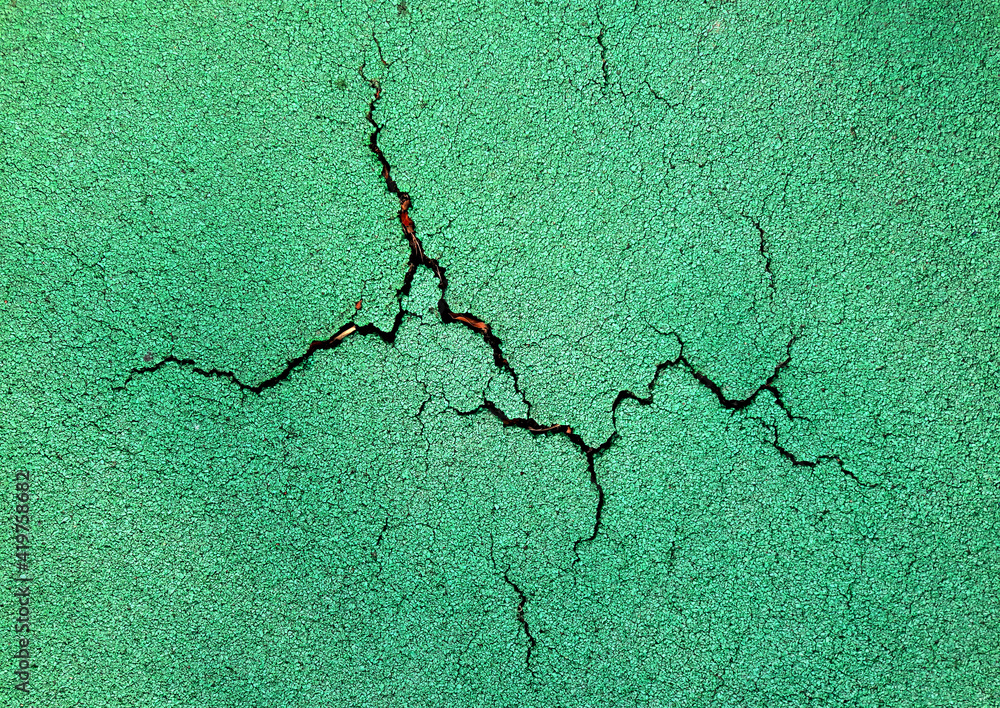 Rubber floor texture background. EPDM playground surface. Green cracked ...
