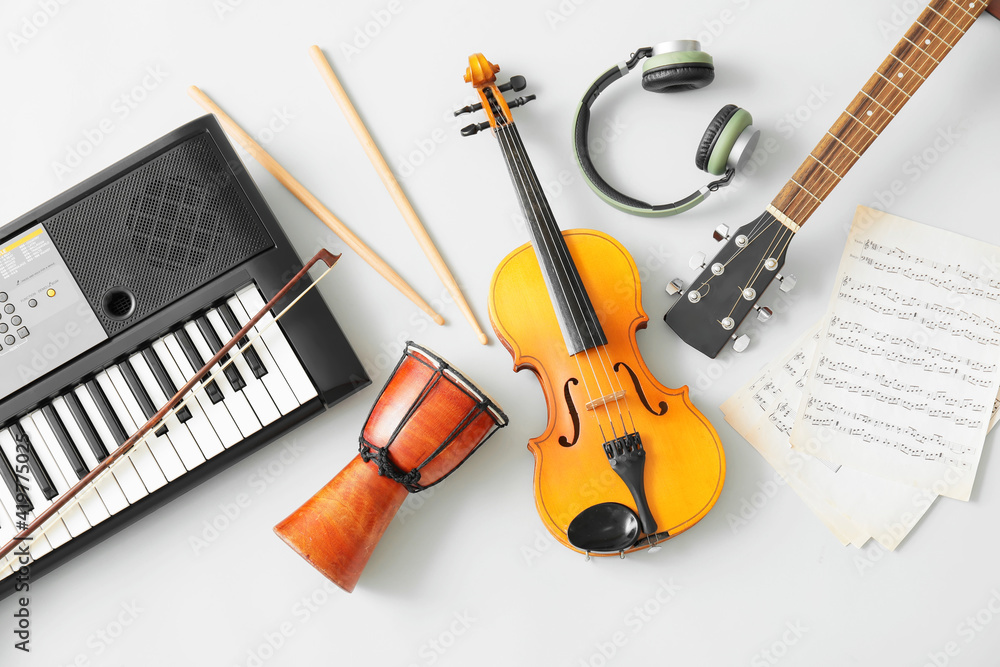 Different musical instruments and music notes on light background Stock ...