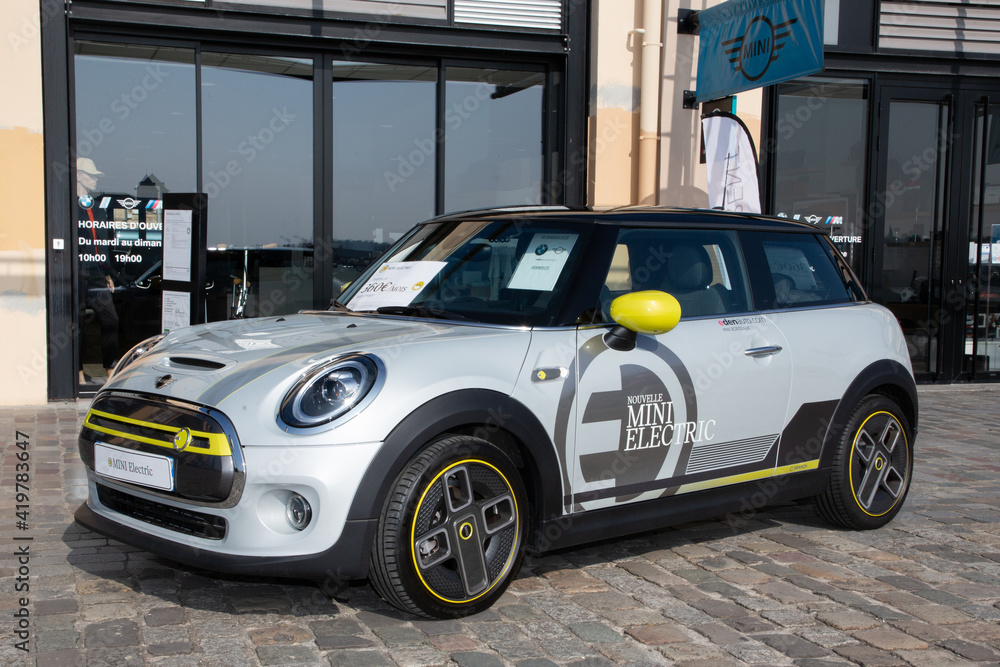 mini electric car side view from england parked front showroom of ...