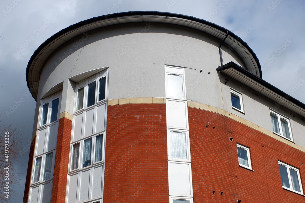 Contemporary apartment building with circular roof in town centre in ...