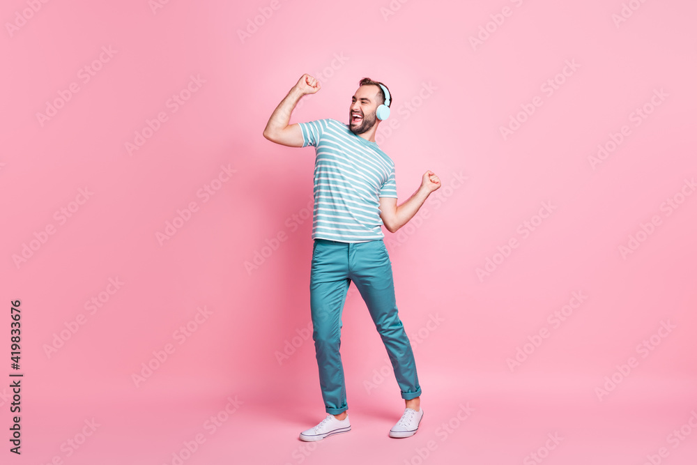 Full length body size view of nice cheerful guy listening melody rock ...