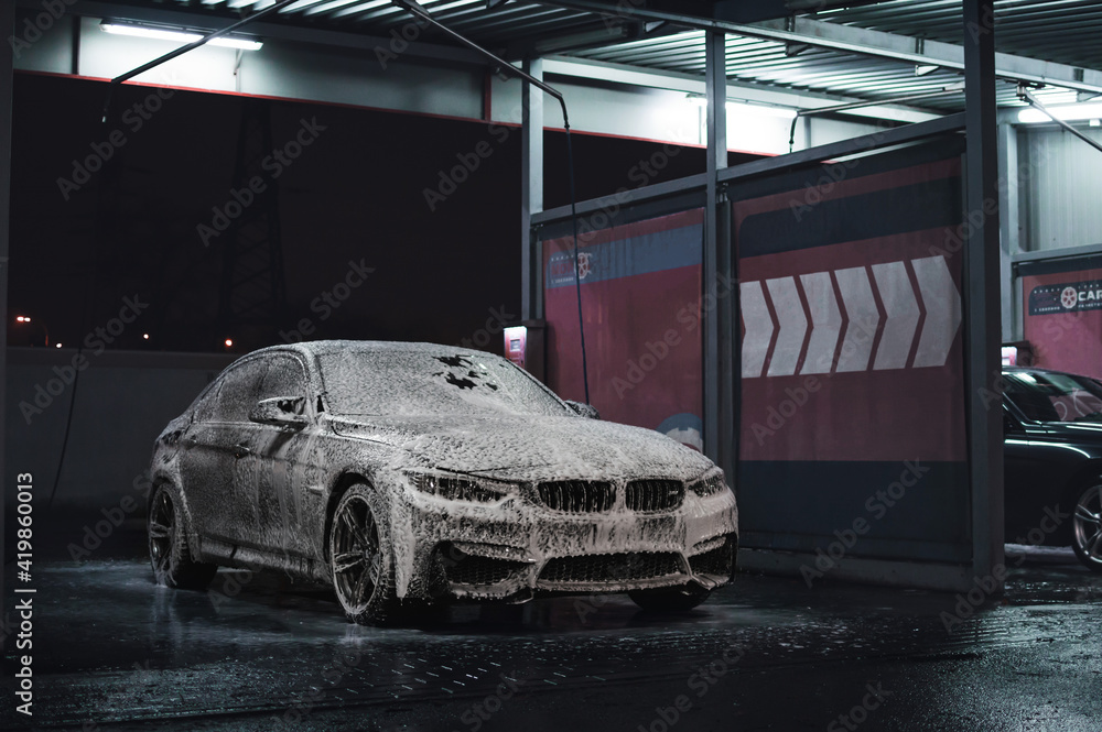 Kyiv, Ukraine - November 2019. BMW M3 F80 at the night car wash station ...