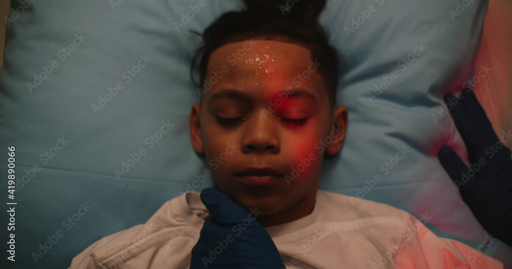 Top view of sick african unconscious kid in ambulance car Stock Photo ...