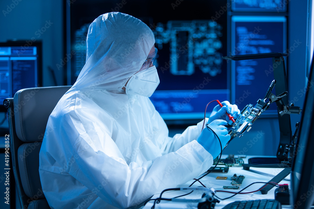 Microelectronics engineer works in a modern scientific laboratory on ...