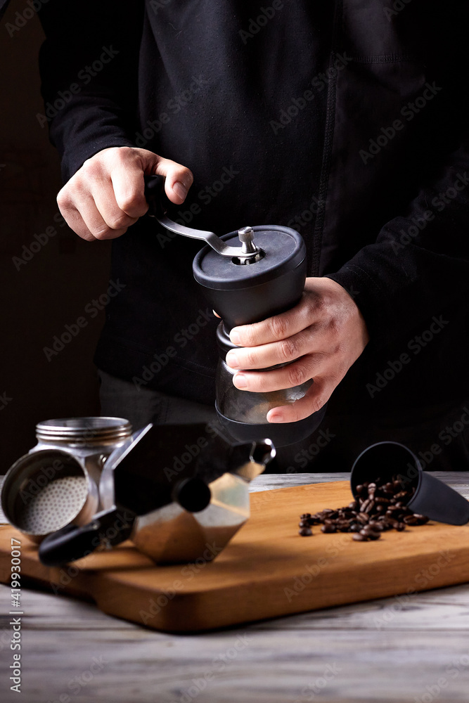 Man Grinding Coffee