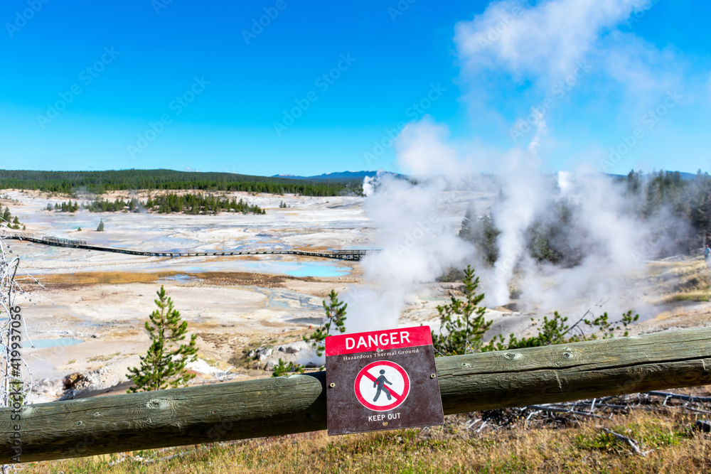 Danger Hazardous Thermal Ground warning sign. Blurred scenic landscape ...