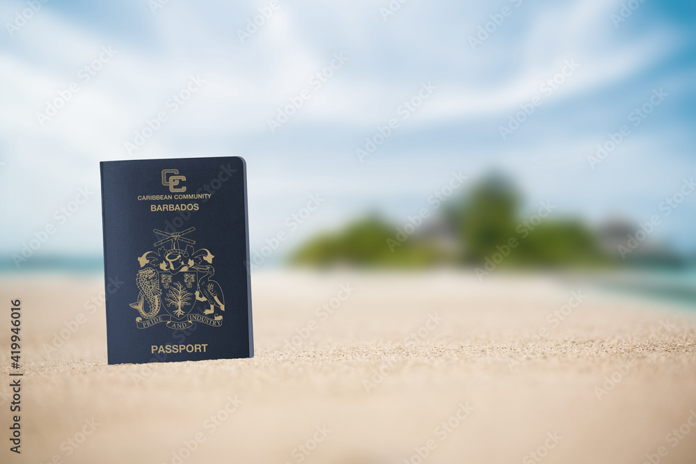 Barbados passport on the beach sand ,Space for writing ,citizenship ...