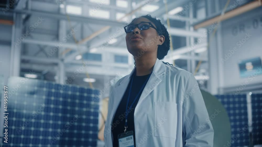 Brilliant Female Engineer Looking Around in Wonder at the Aerospace ...