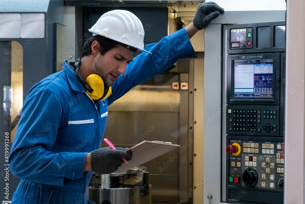 Smart factory worker or engineer do machine job in manufacturing ...