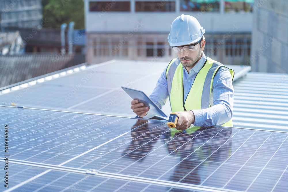 engineer man inspects construction of solar cell panel or photovoltaic ...