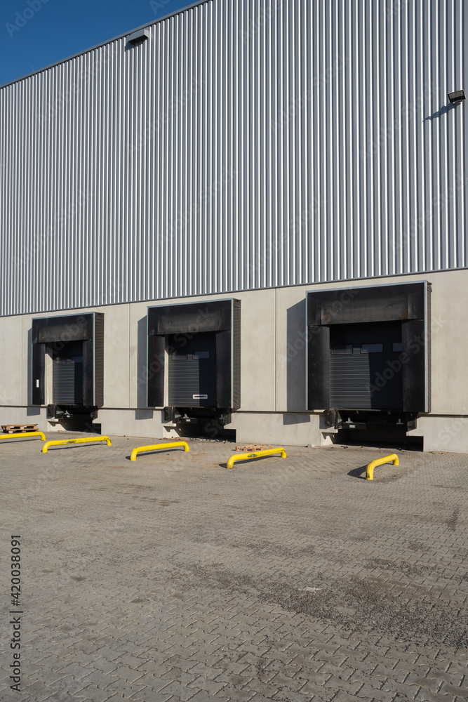empty loading ramps of a warehouse. cargo loading bay. Stock Photo ...