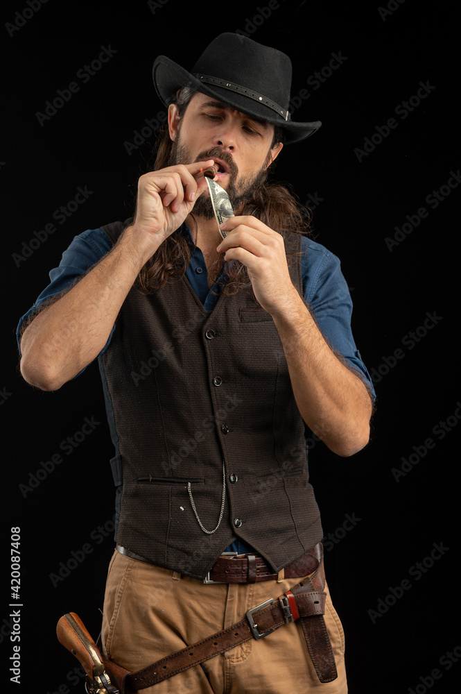 Cowboy with guns. Studio shooting Stock Photo | Adobe Stock