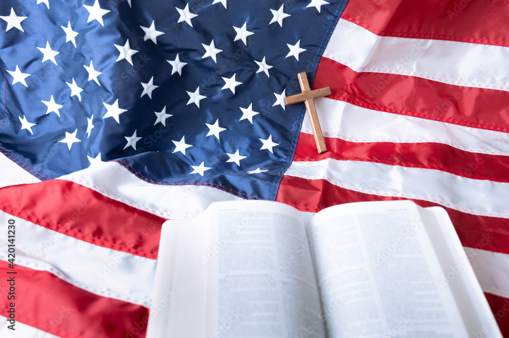 Open Holy bible and Wooden cross over American flag background. Stock ...