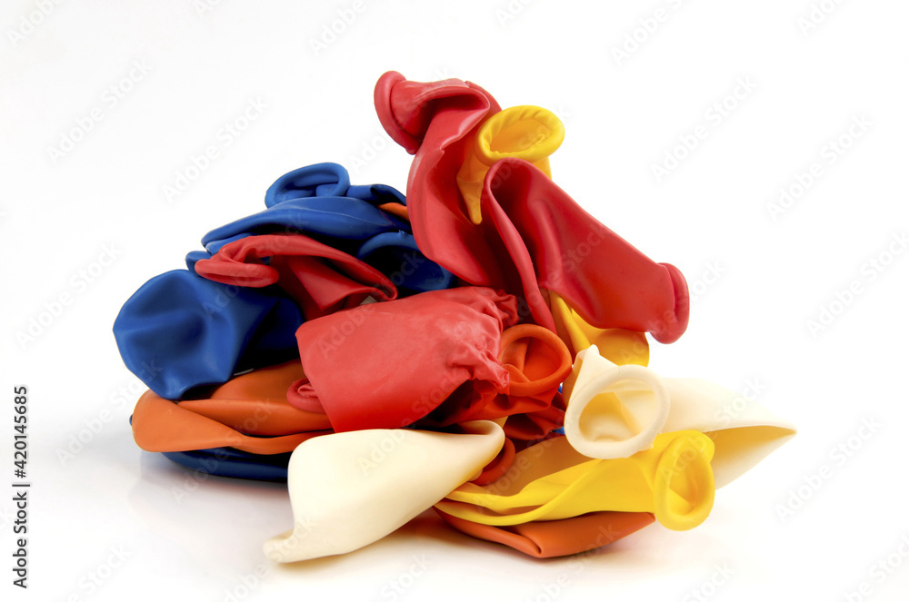 Pile of colorful deflated balloons isolated on a white background Stock ...