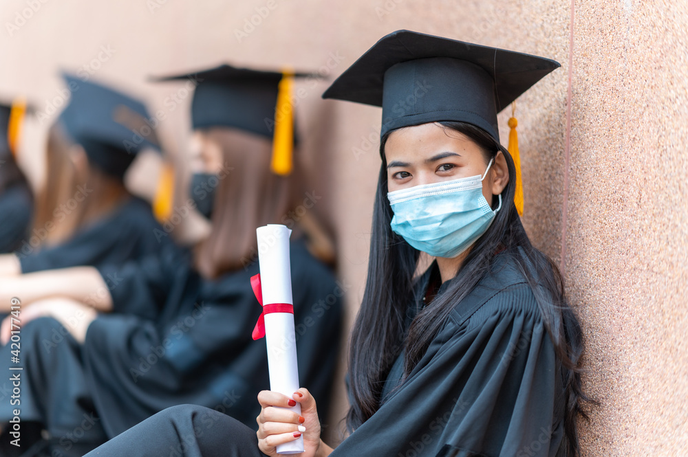 The class of 2021,group of graduates Asian student Wear a mask at a ...