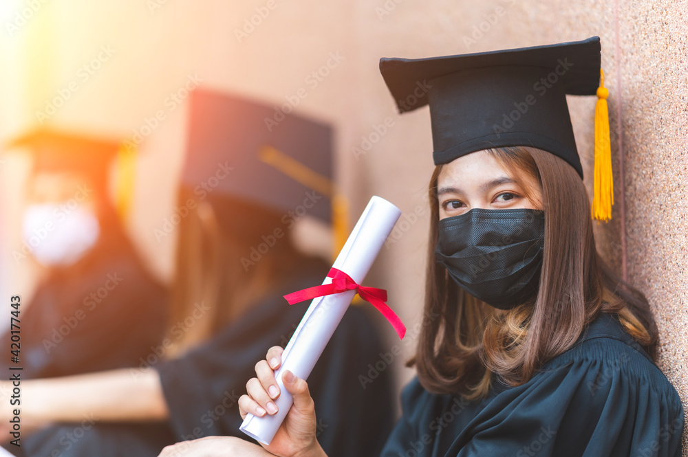 The class of 2021,group of graduates Asian student Wear a mask at a ...