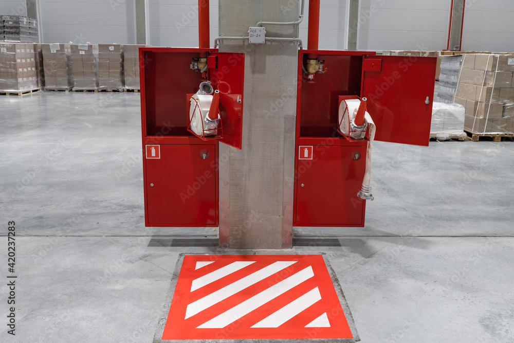 fire safety in the warehouse. new fire hydrants. red box. fire ...