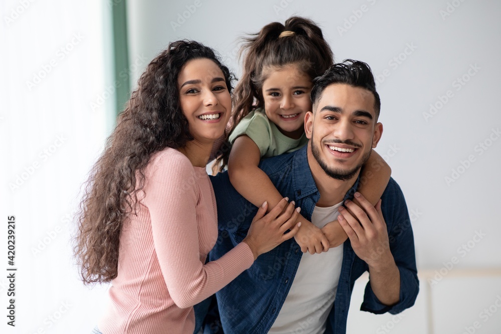Portraif Of Happy Young Arabic Family Of Three With Little Daughter ...