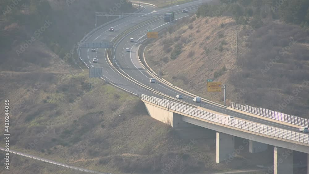 Elevated view of traffic on A1 highway and Crni Kal viaduct. Vehicles ...