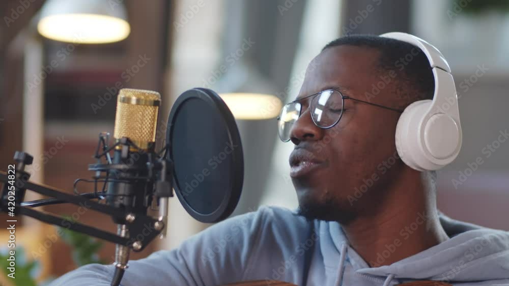 Handheld camera shot of young black man on wheelchair in wireless ...