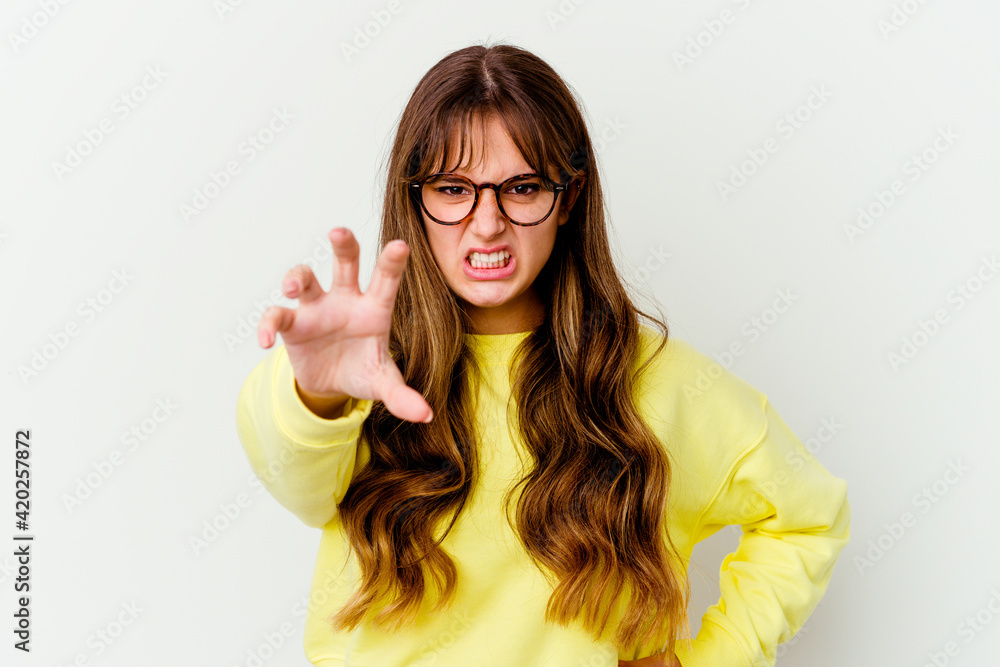 Young caucasian cute woman isolated on white background showing claws ...