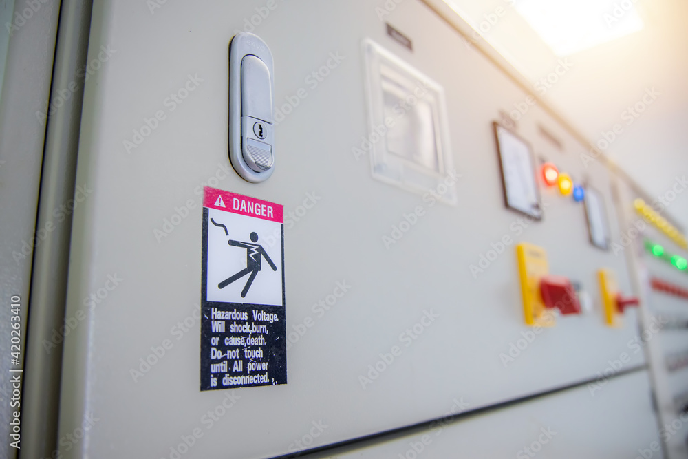 Hazardous voltage sign in main distribution board of electric plant ...