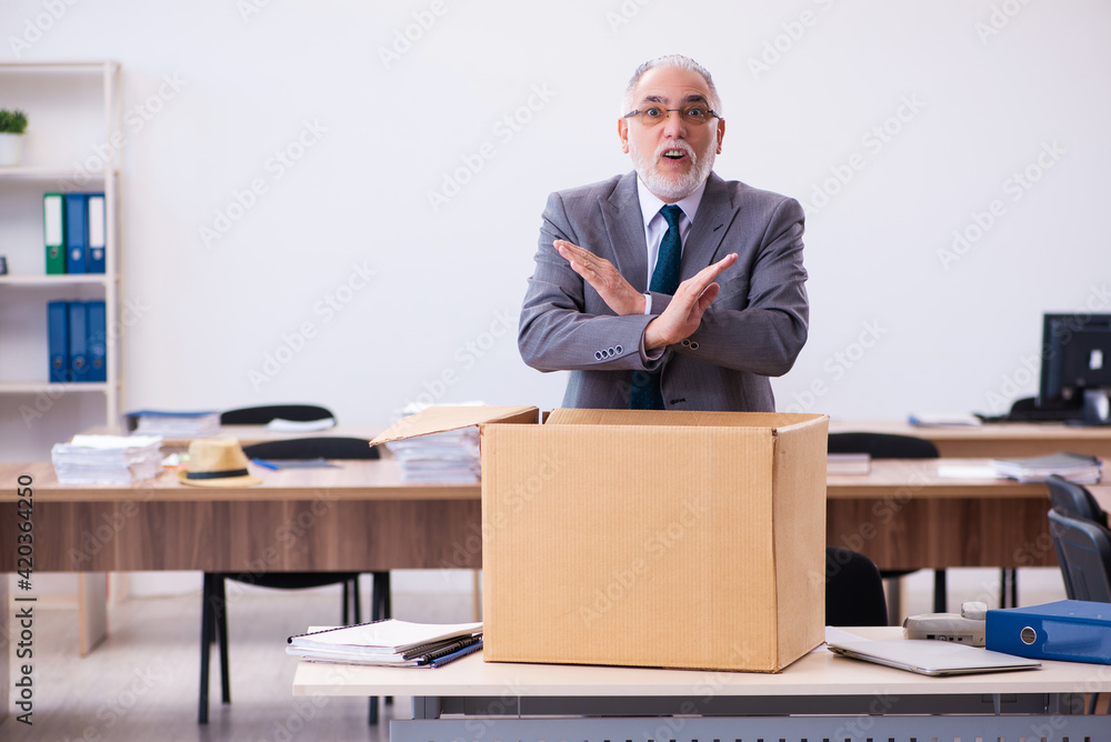 Old male employee being fired from his work Stock Photo | Adobe Stock