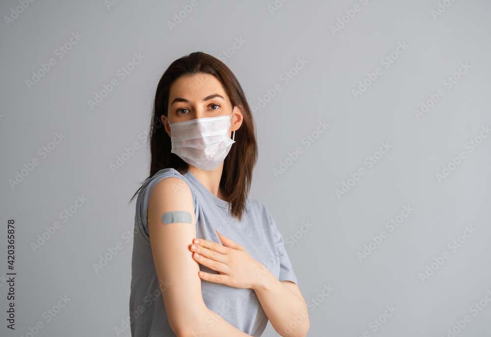Young woman after vaccination Stock Photo | Adobe Stock