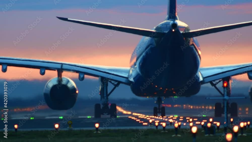 two engine jet airplane prapairing to start at the airport of linz ...