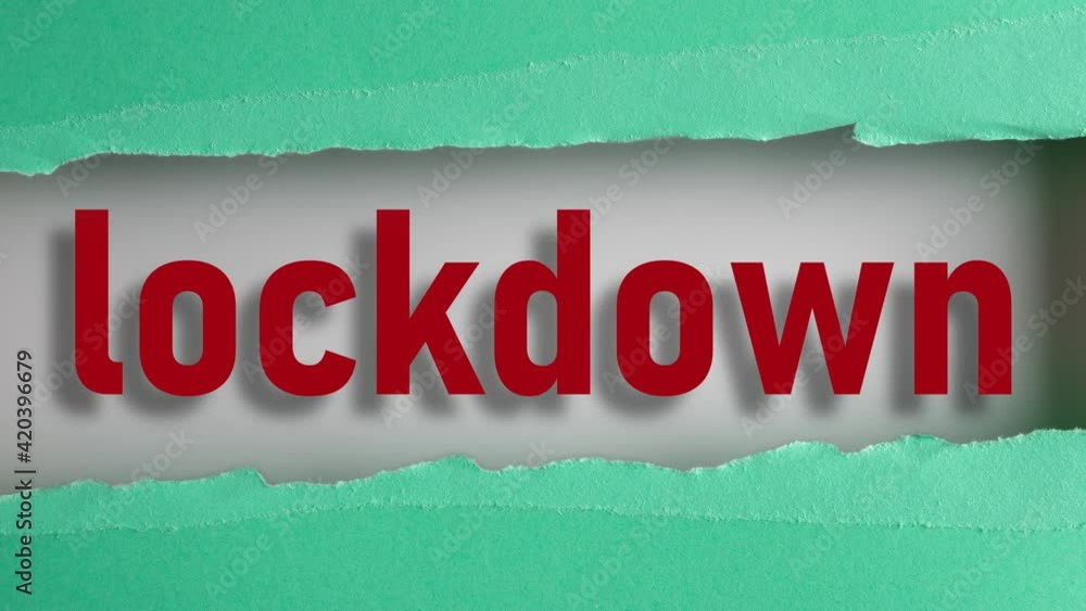 Green paper is torn over word "lockdown" on white background, stop ...