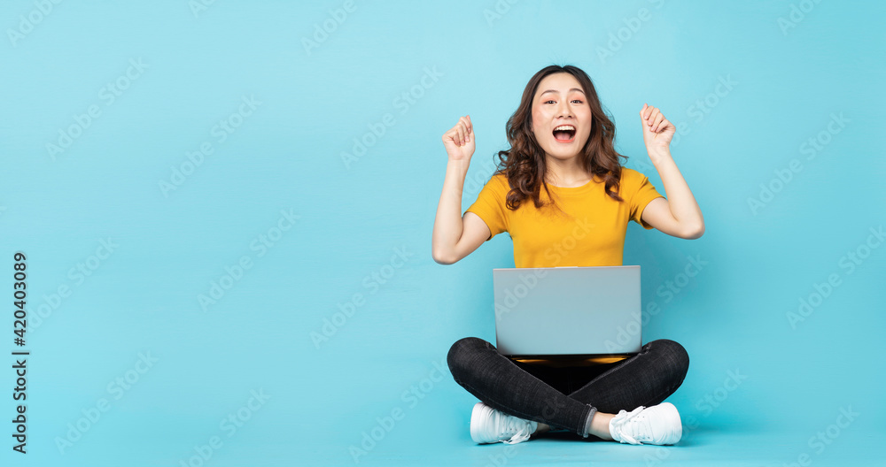 Young girl sitting using laptop with expressions and gestures on ...
