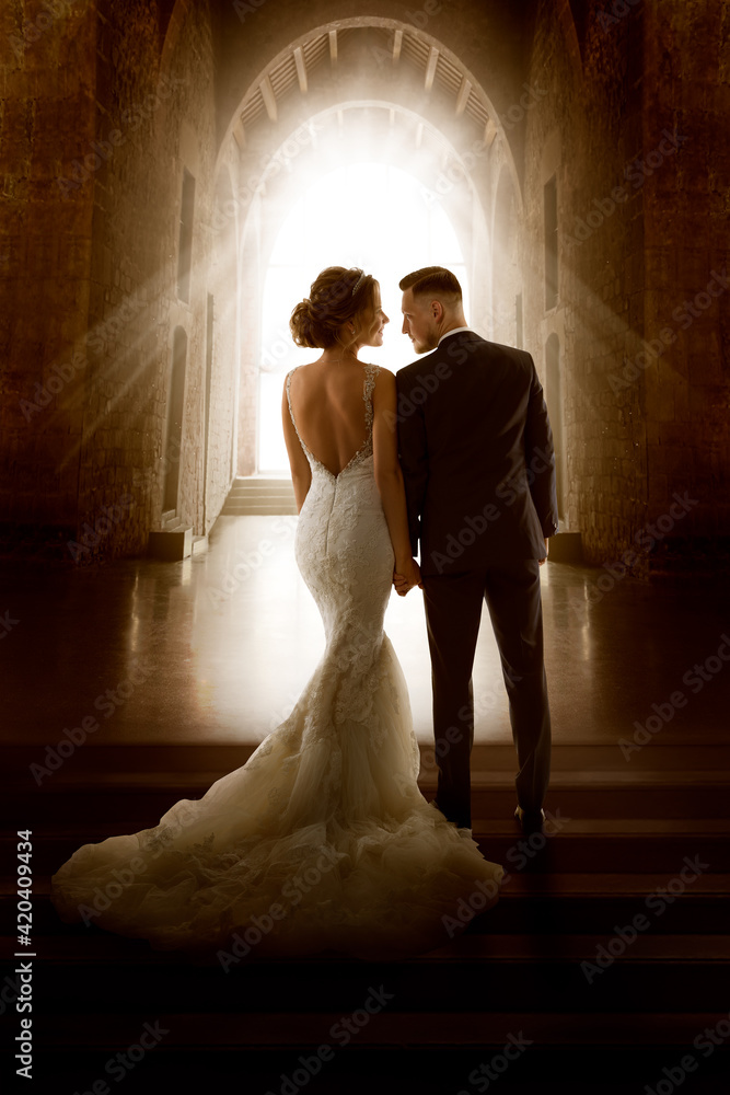 Wedding Couple in Love Back View walking down Aisle Church. Newly ...