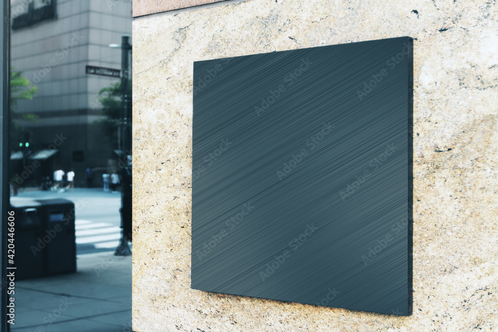 Black square sign with blank space for your logo on the marble wall of ...