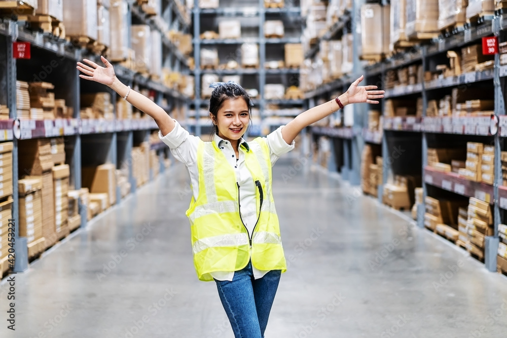 Shot of cheerful positive warehouse workers having fun at work, .Asian ...