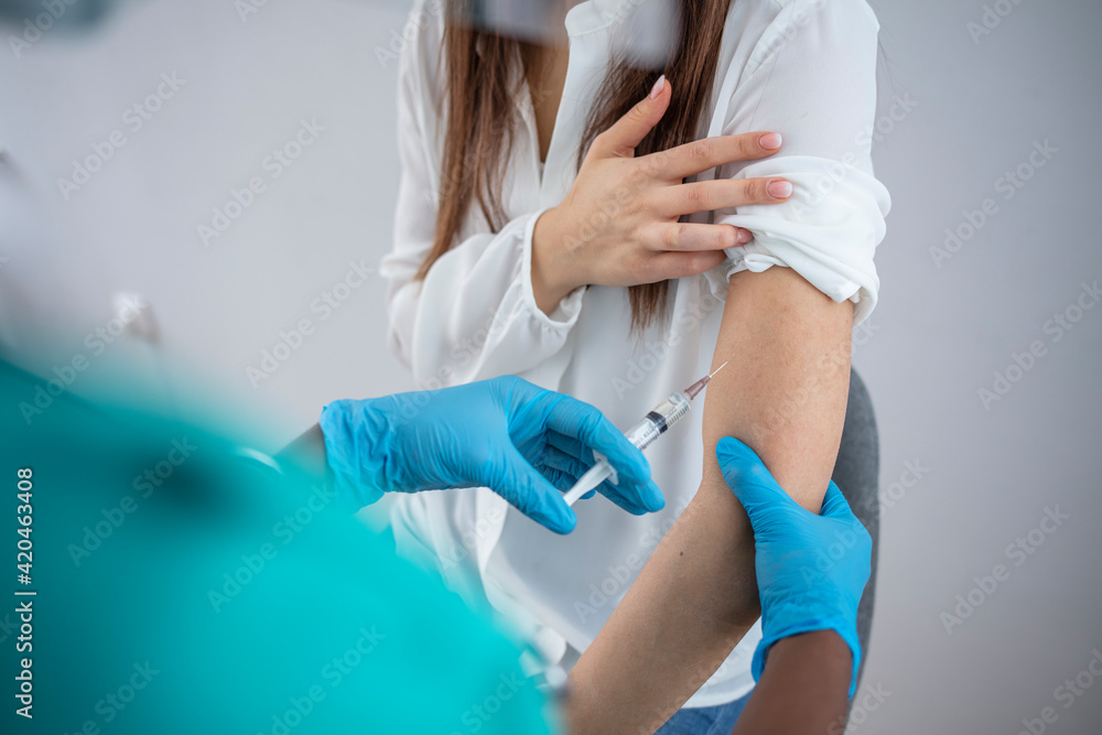 Vaccines. Professional Female Doctor in Blue Sterile Gloves Injecting ...