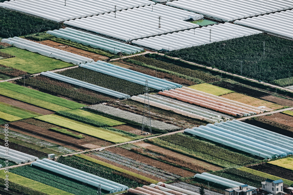 aerial view of agricultural plots of land under cultivation in an ...