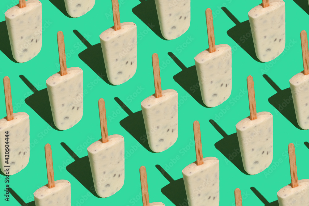 Vanilla ice pops on mint green background Stock Photo | Adobe Stock