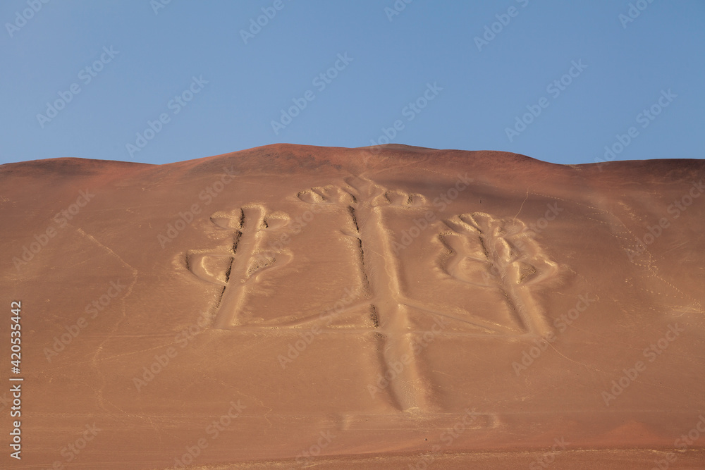 Photograph of the Paracas Candelabra, a famous 180-meter long geoglyph ...