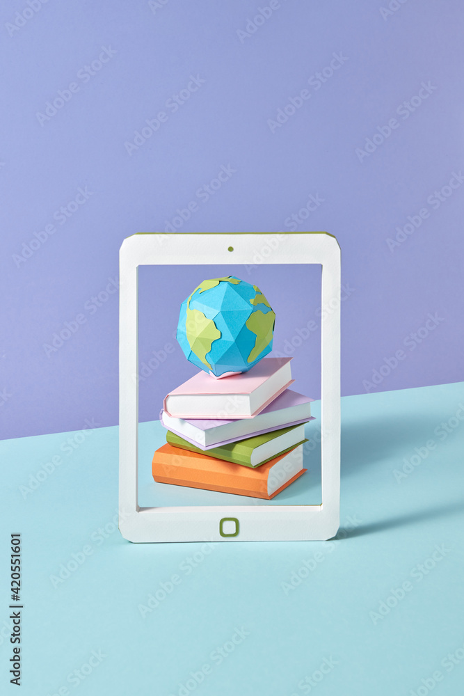 Papercraft tablet screen with books and globe. Stock Photo | Adobe Stock